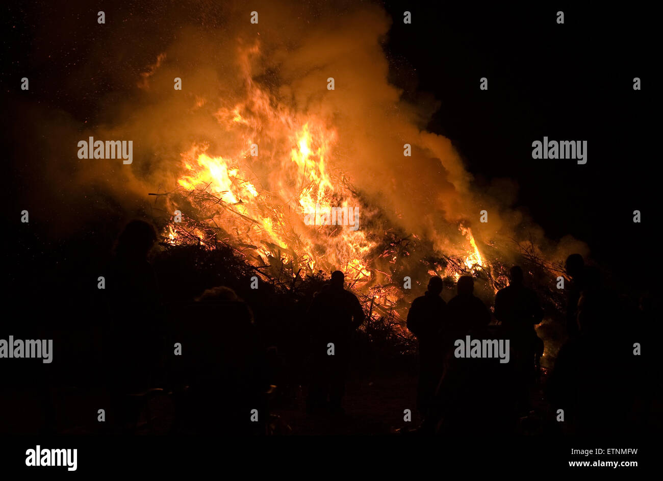 People are watching a huge bonfire, a tradition with easter in North ...