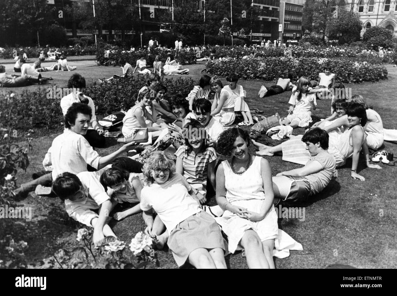 Sun worshippers in Victoria Square, Middlesbrough, during lunch time ...