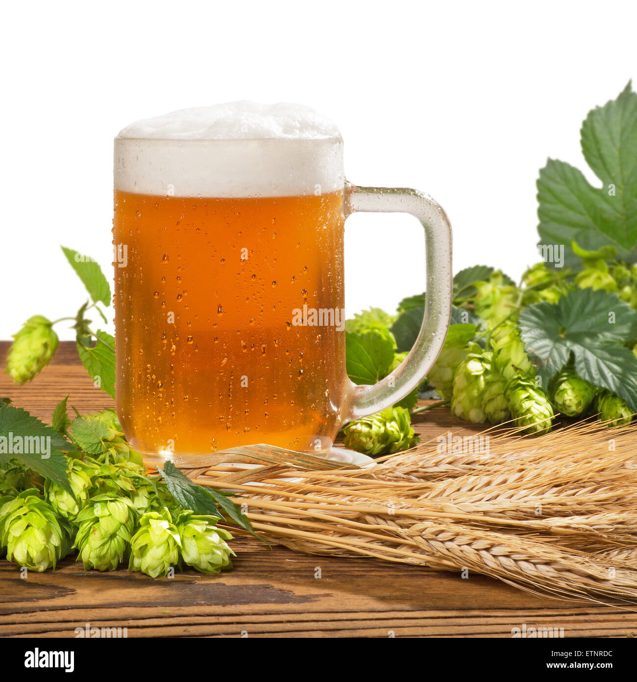 glass of unfiltered beer and raw material for beer production Stock ...