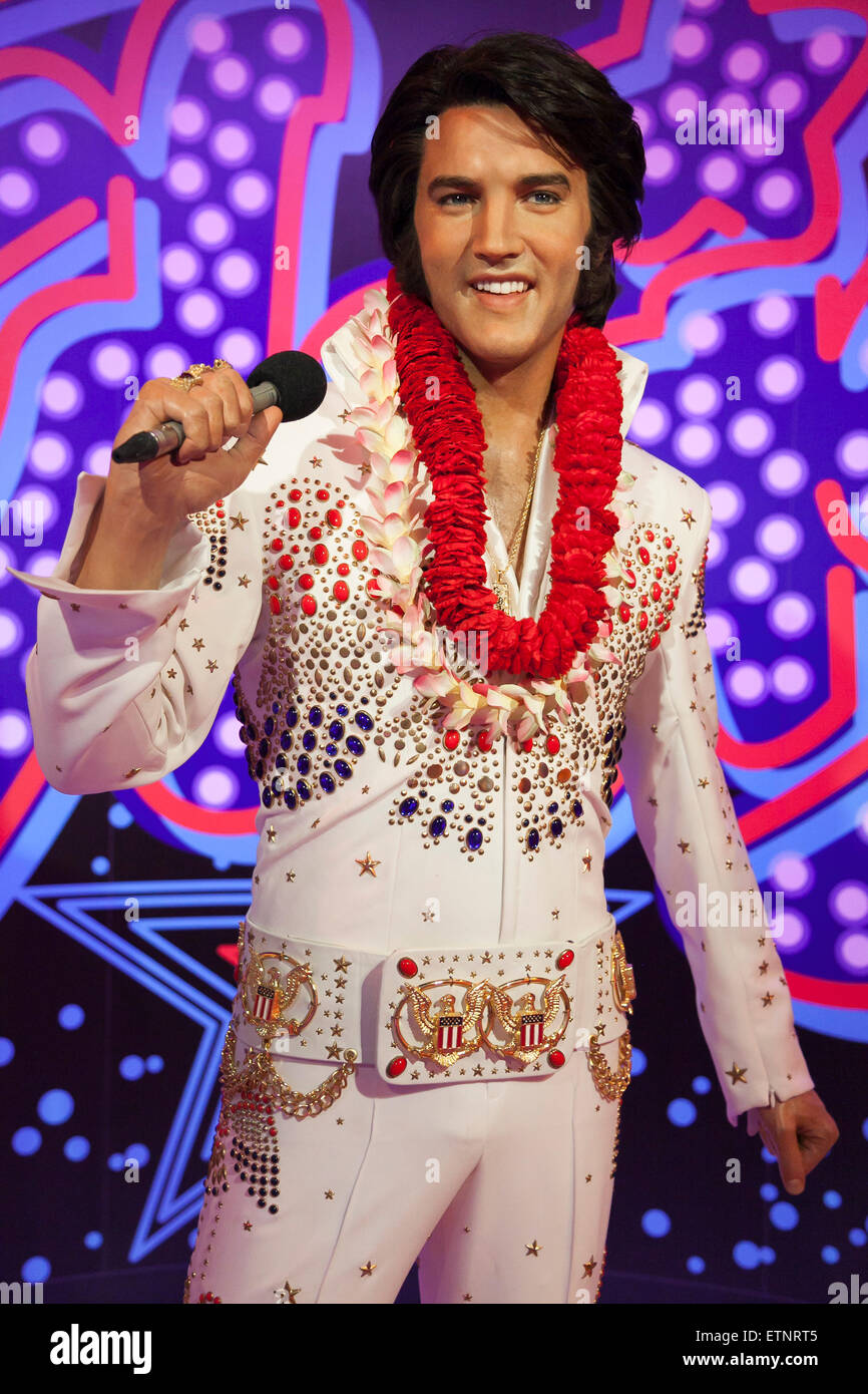 A wax figure of Elvis Presley, American singer and actor on display at ...