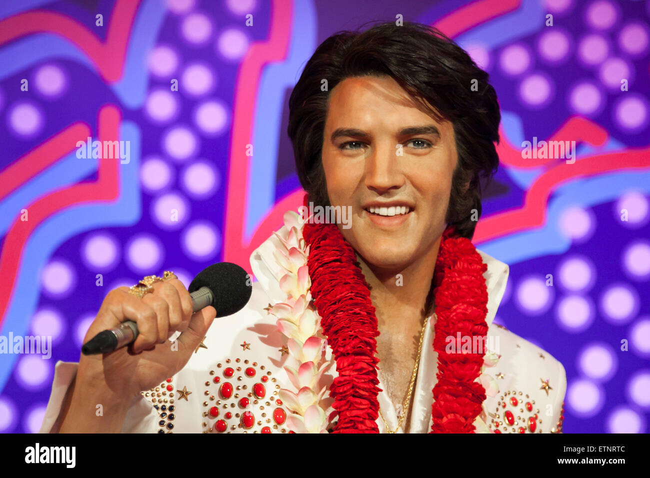A wax figure of Elvis Presley, American singer and actor on display at ...