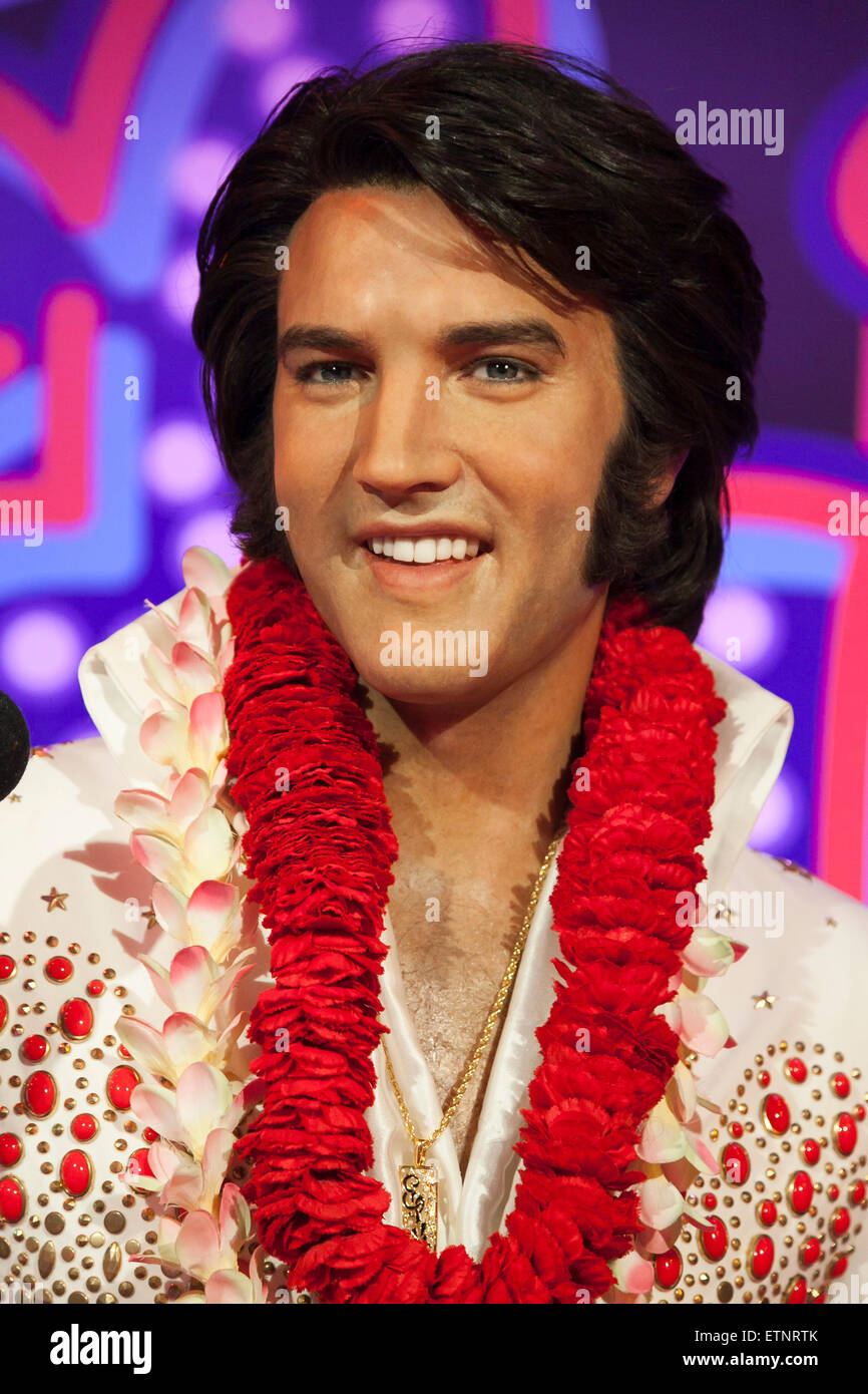 A wax figure of Elvis Presley, American singer and actor on display at ...