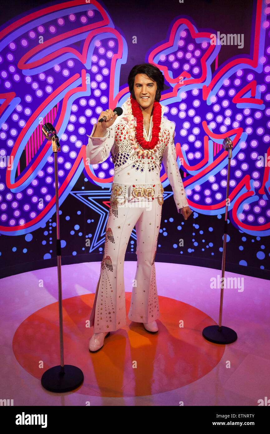 A wax figure of Elvis Presley, American singer and actor on display at ...