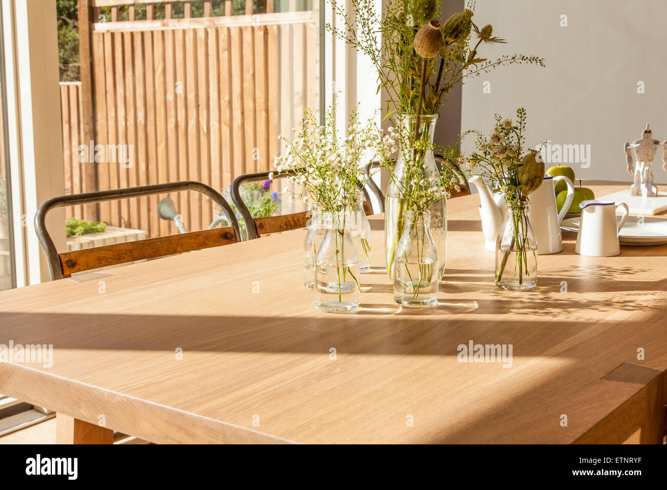 Kitchen table with flowers Stock Photo - Alamy