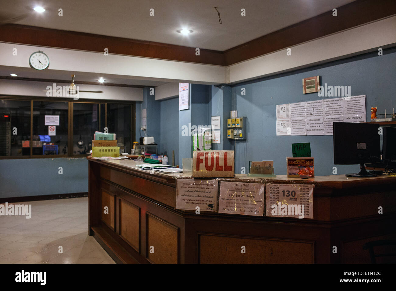 A guest house reception with a FULL sign at night in Soi Rambuttri lane ...