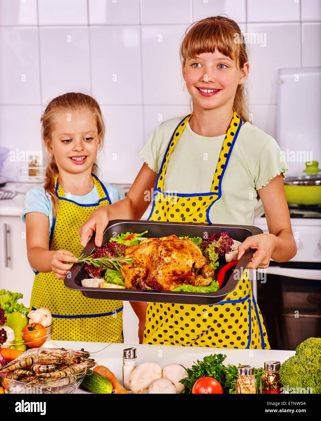 Children cooking chicken at kitchen Stock Photo - Alamy