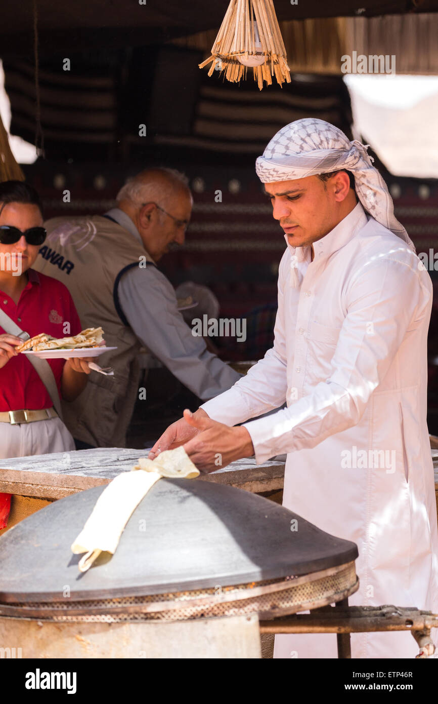 bedouin arab preparing & serving middle eastern food to Tourists at ...