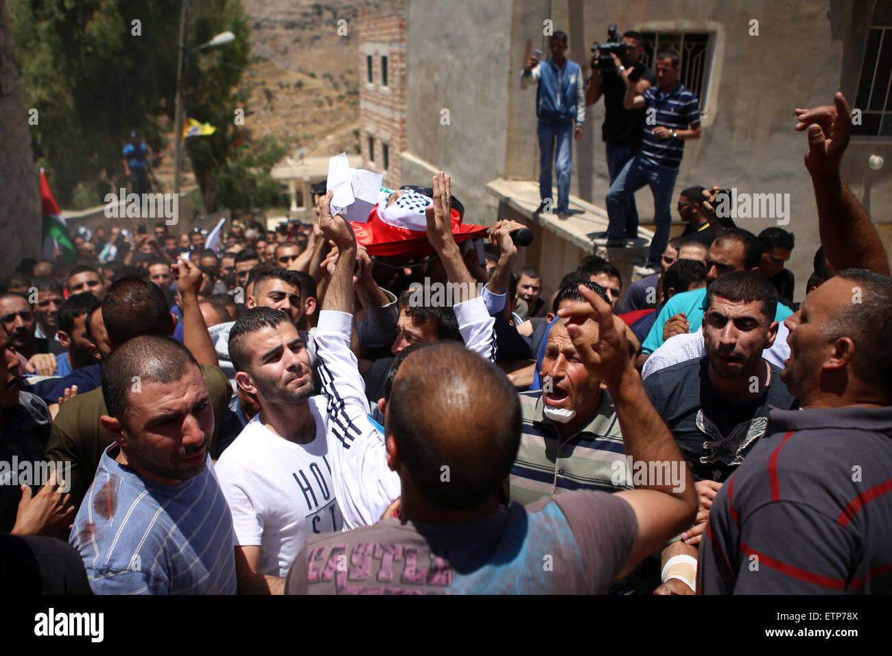 Kafr Malik, West Bank, Palestinian Territory. 14th June, 2015. Mourners ...
