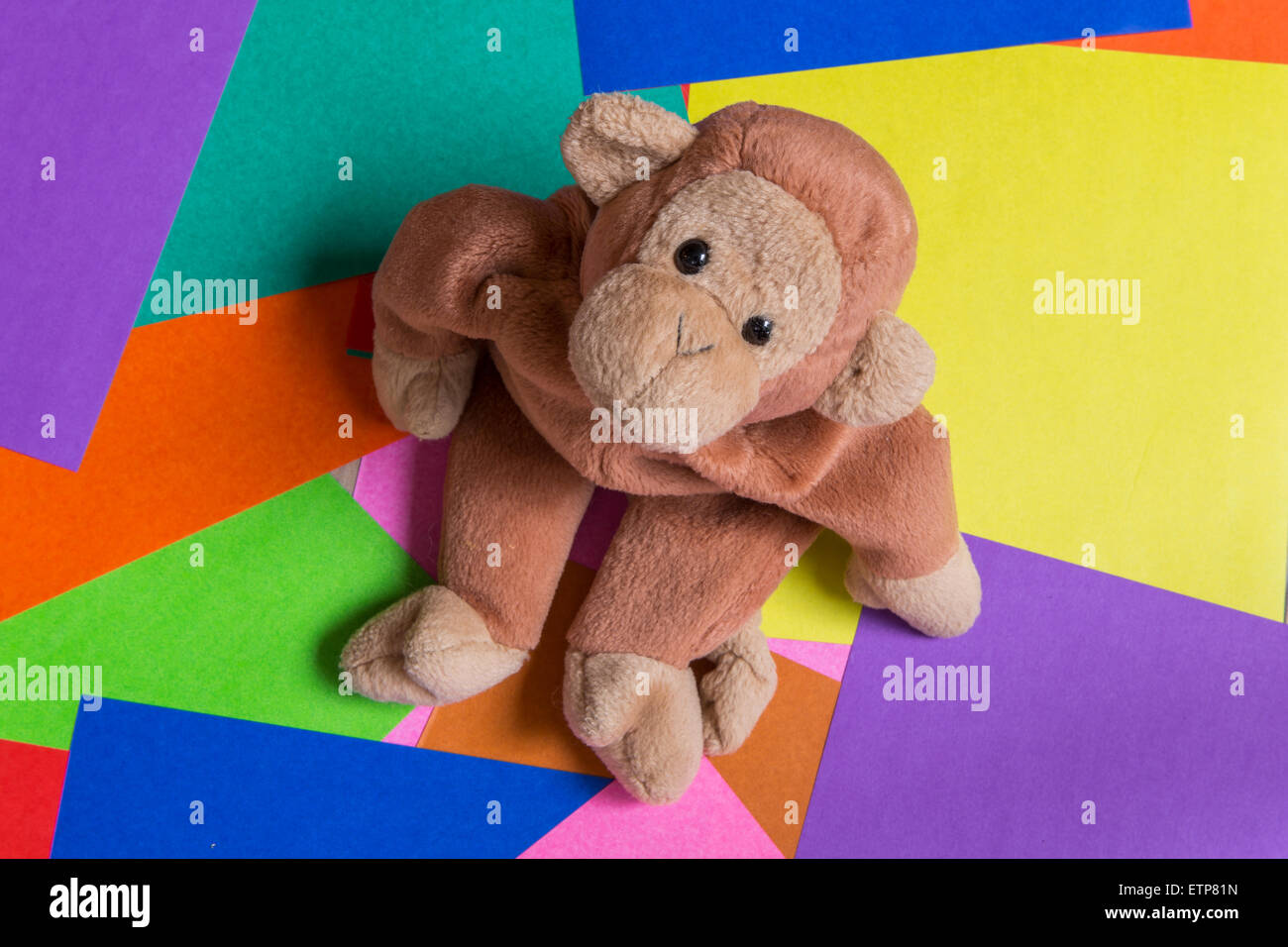 Monkey Doll on Colorful Background Stock Photo - Alamy
