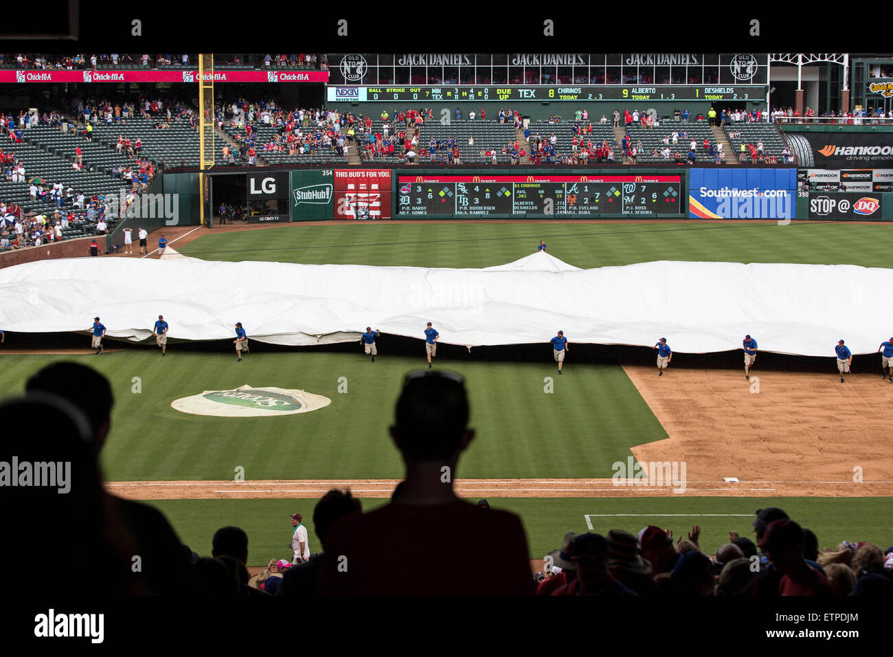 Arlington, TX, USA. 13th June, 2015. Texas Rangers grounds crew rolls ...