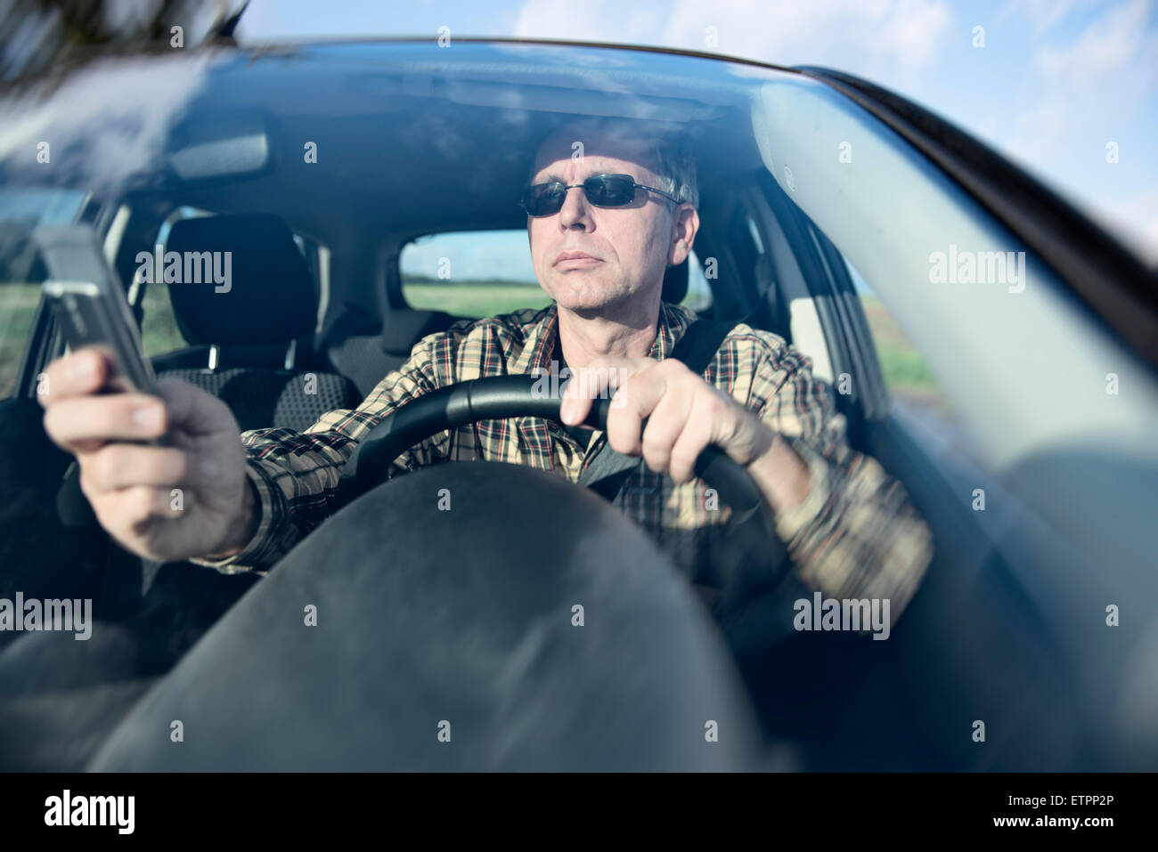 Man phoning while driving Stock Photo - Alamy