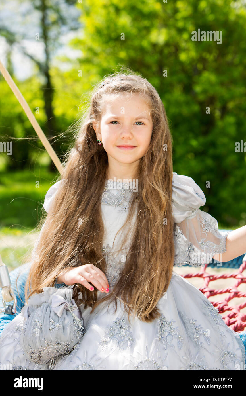 Long-haired girl in a grey princess dress Stock Photo - Alamy