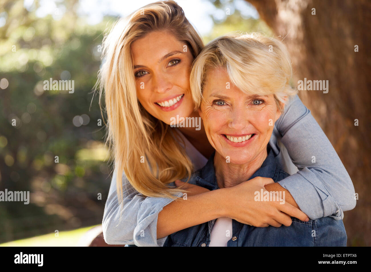 loving daughter hugging middle aged mother outdoors Stock Photo - Alamy