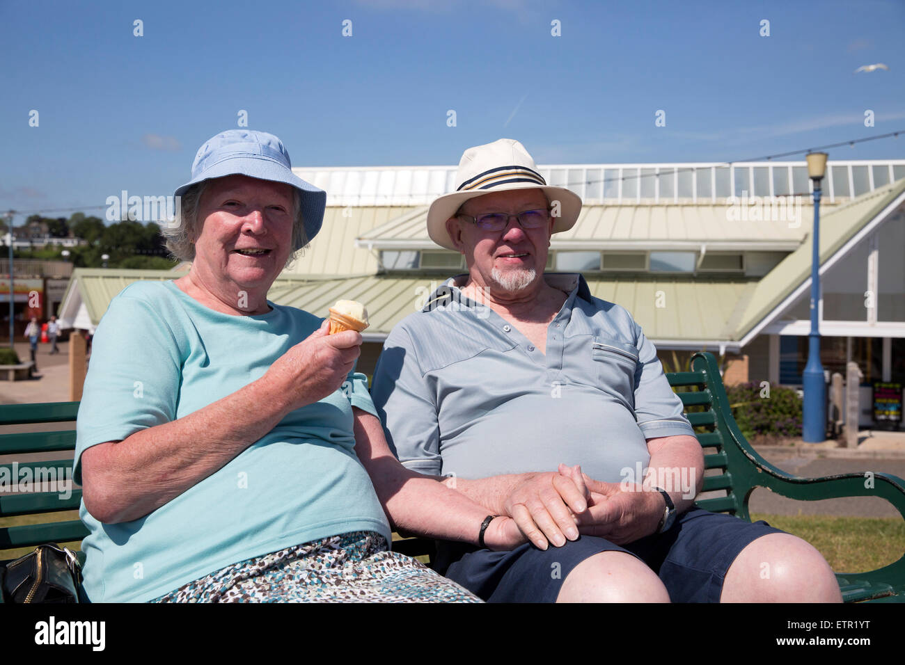 Dawlish, UK. 15th June, 2015. An elderley couple enjoy an ice cream in ...