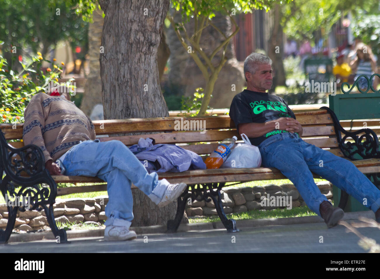 Tired people on a bench hi-res stock photography and images - Alamy