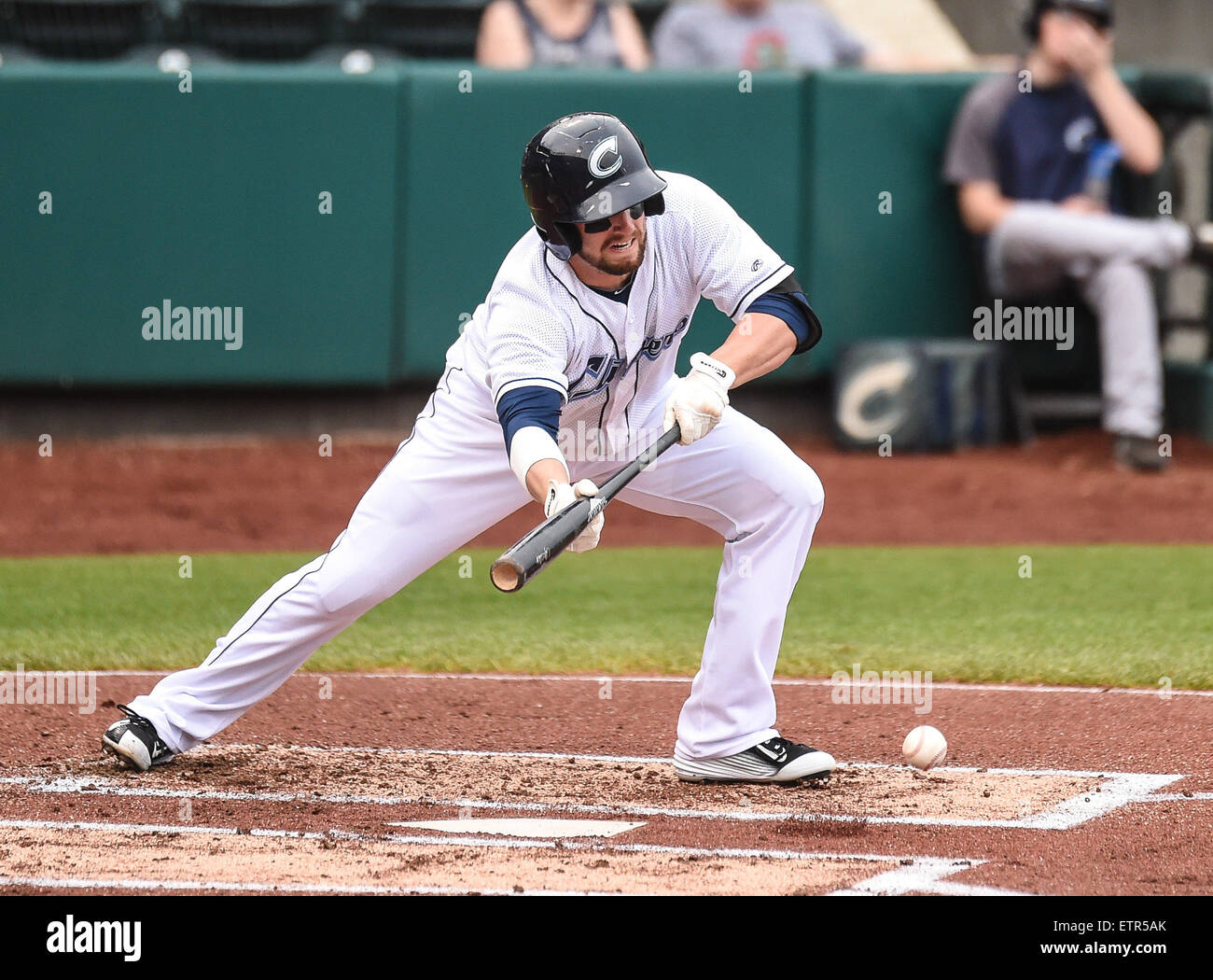 June 12, 2015: Columbus Clippers right fielder Jerry Sands (28) bunts ...