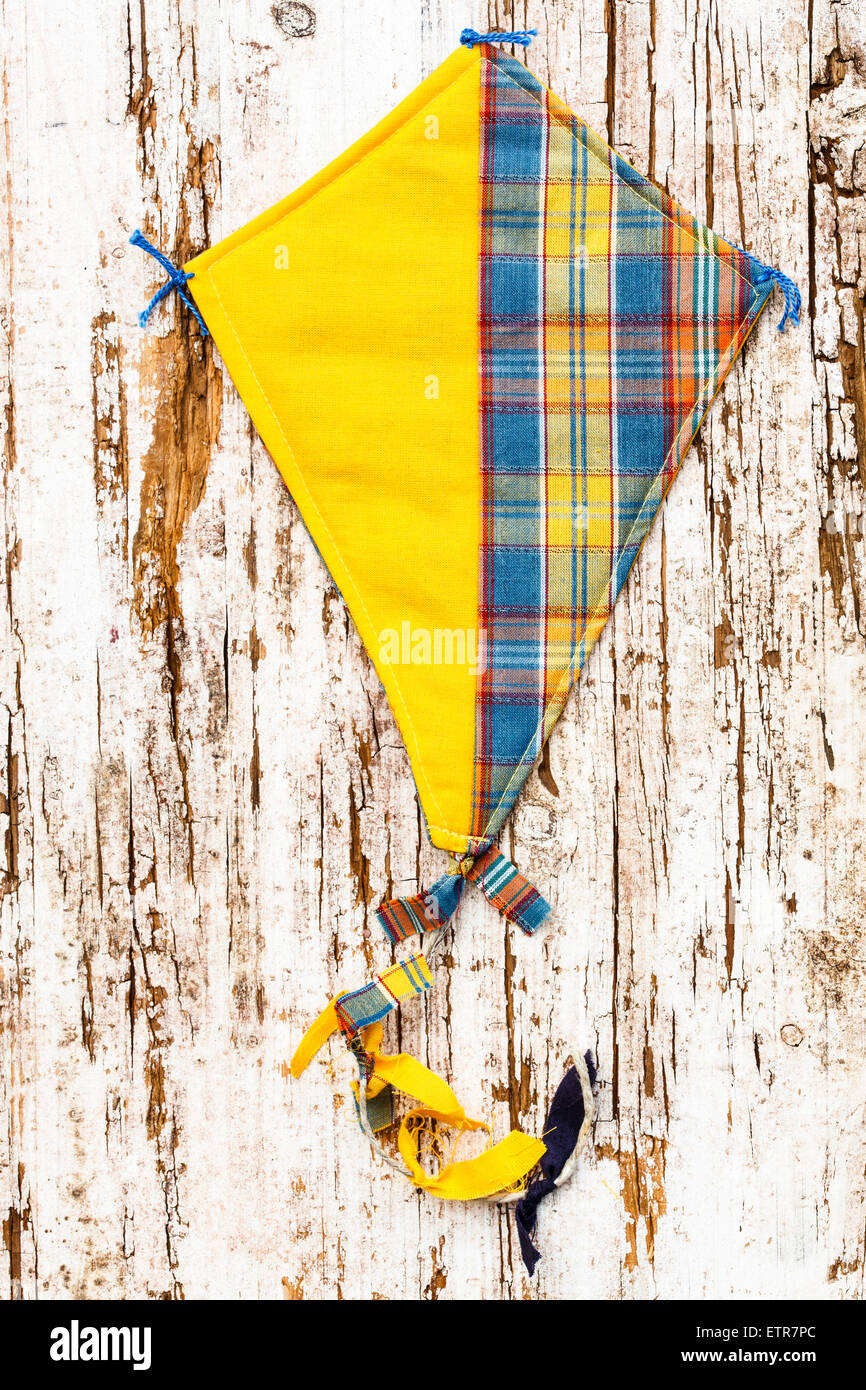 Decoration, kite on weather-beaten wooden board Stock Photo - Alamy
