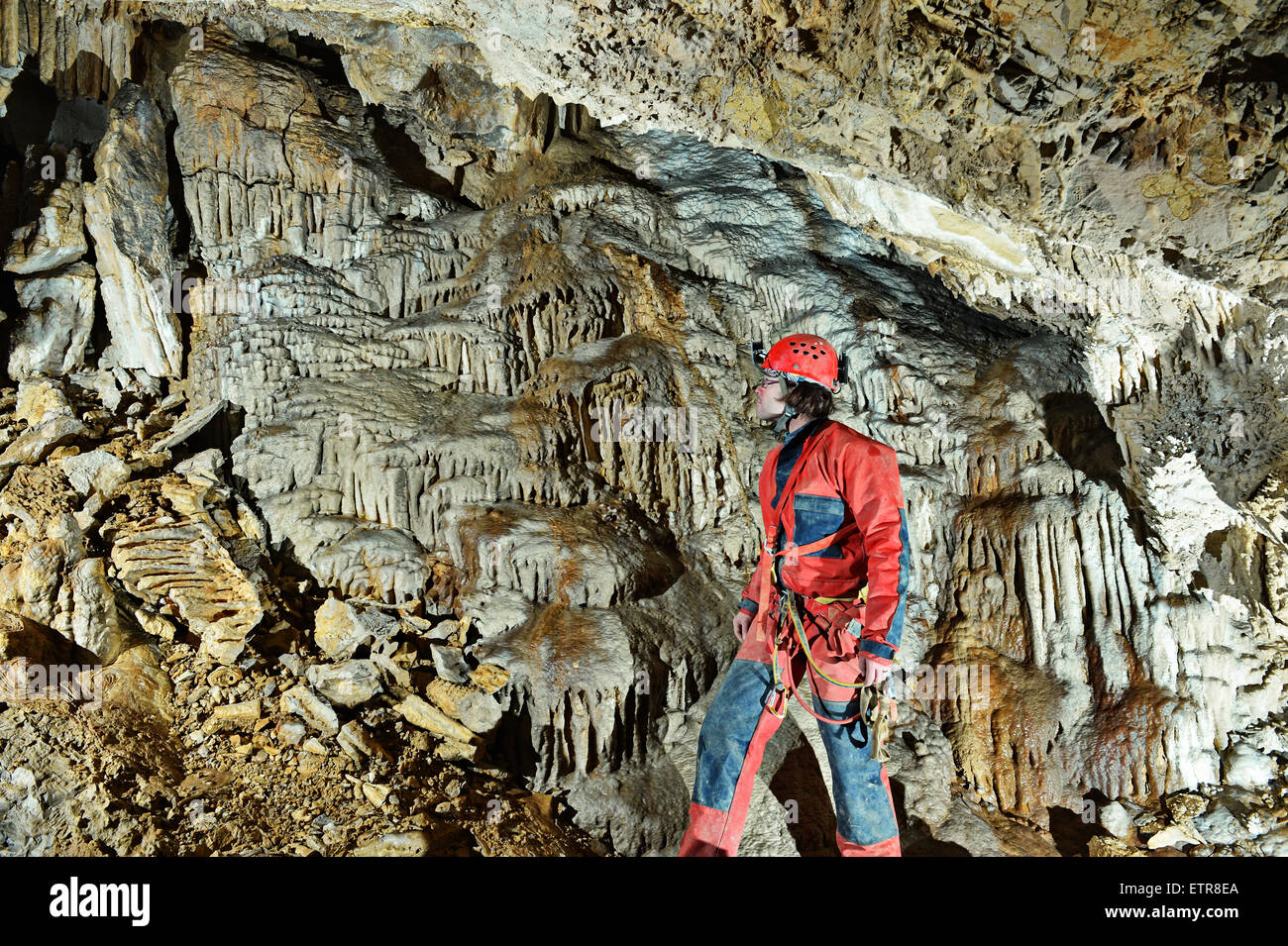 Cave explorer in front of sinter cascades Stock Photo - Alamy