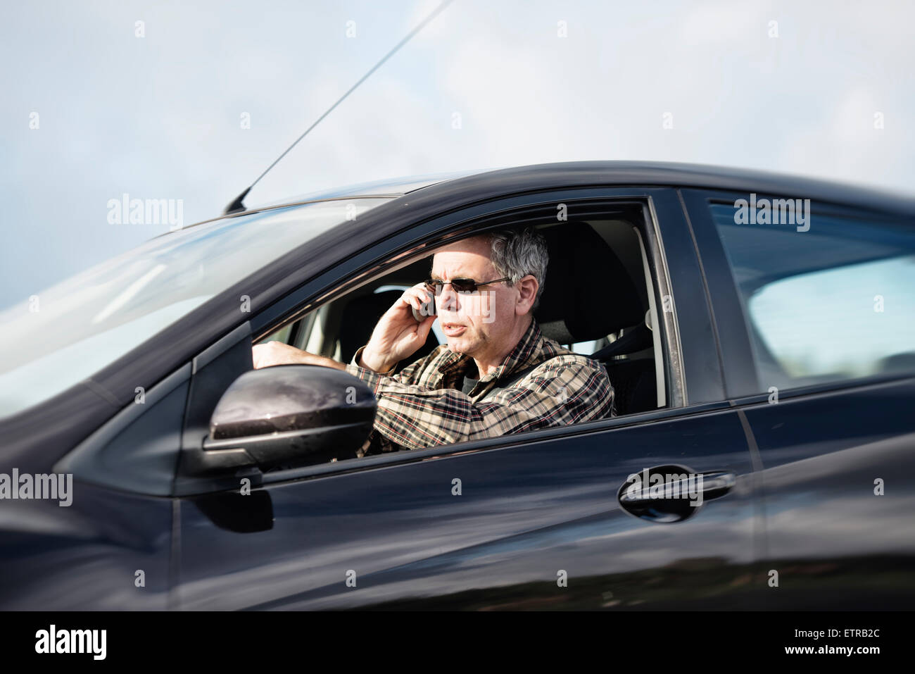 Man phoning while driving Stock Photo - Alamy
