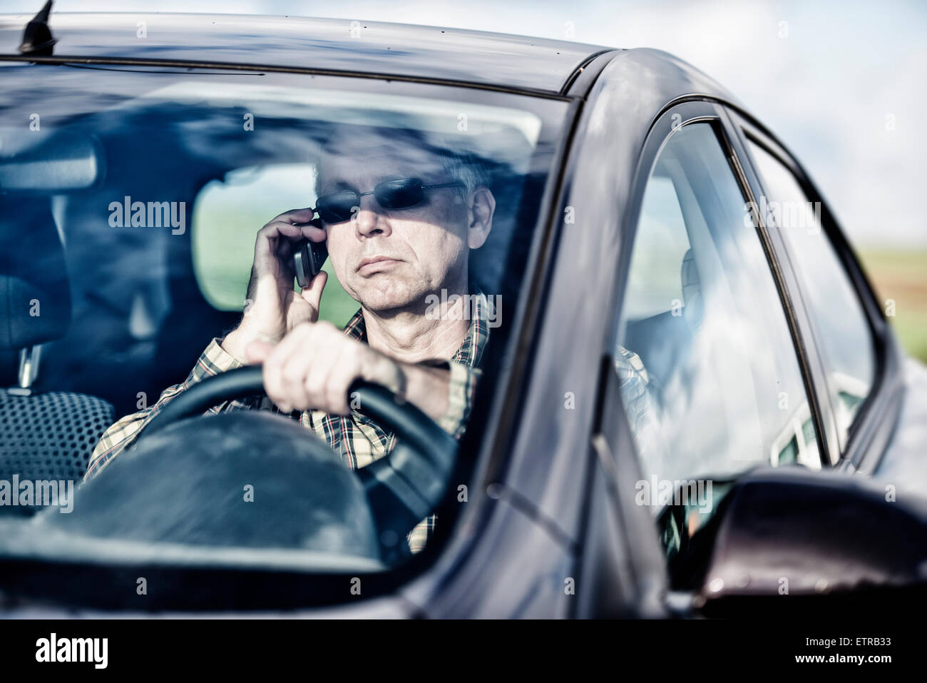 Man phoning while driving Stock Photo - Alamy