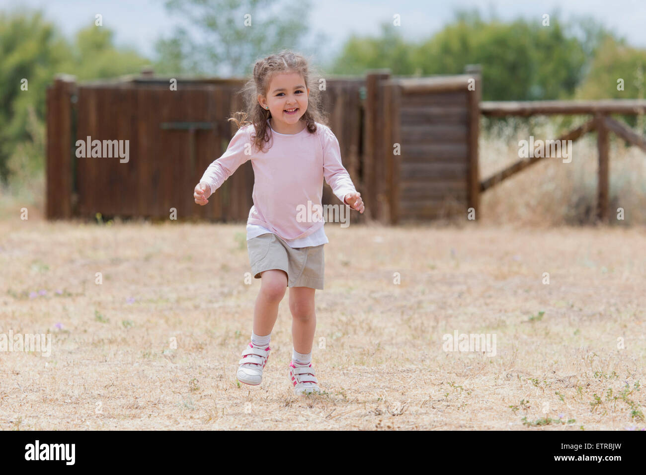 Beautiful caucasian girl running and laughing Stock Photo - Alamy