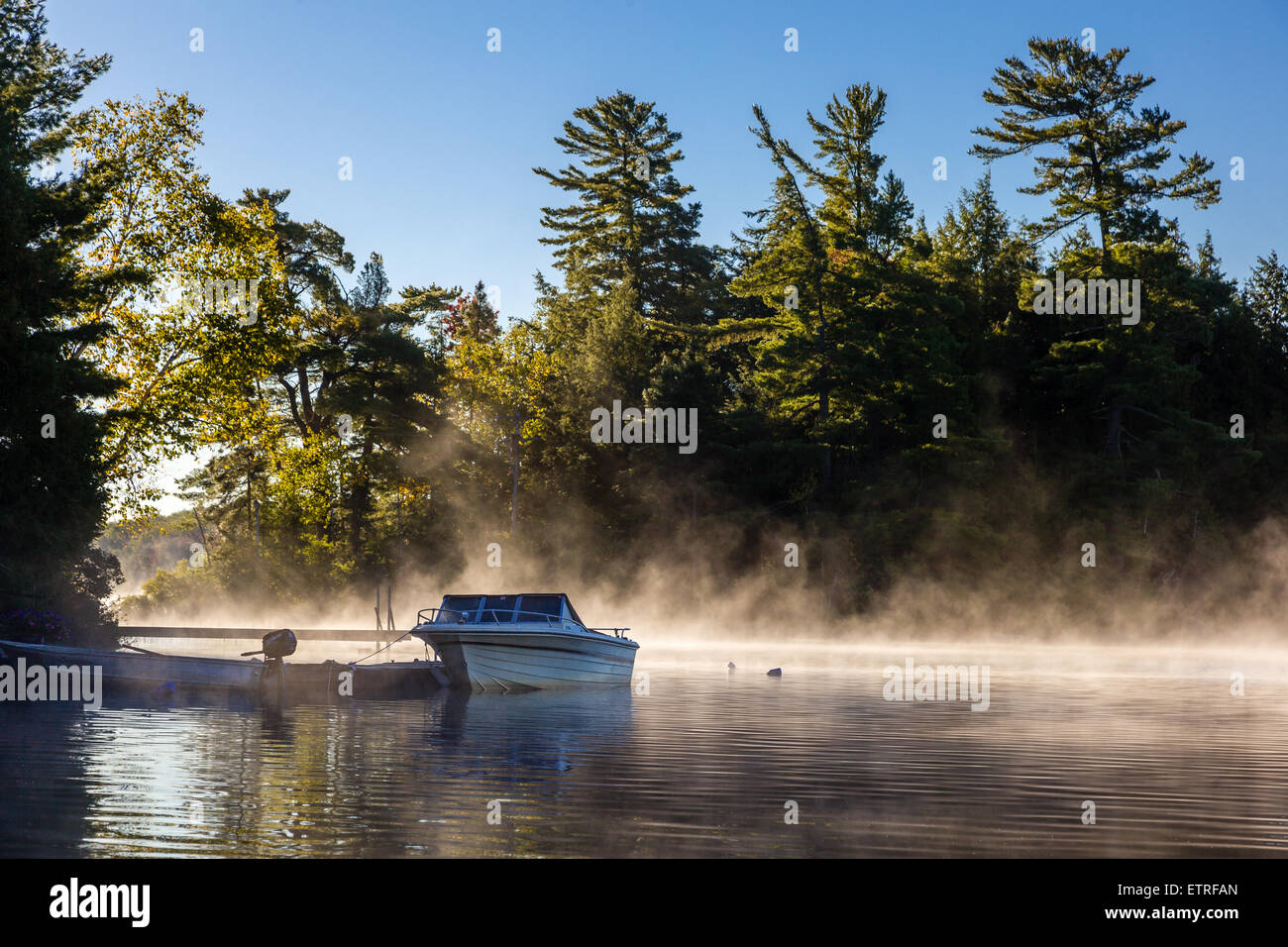 Lake boat in morning mist hi-res stock photography and images - Alamy