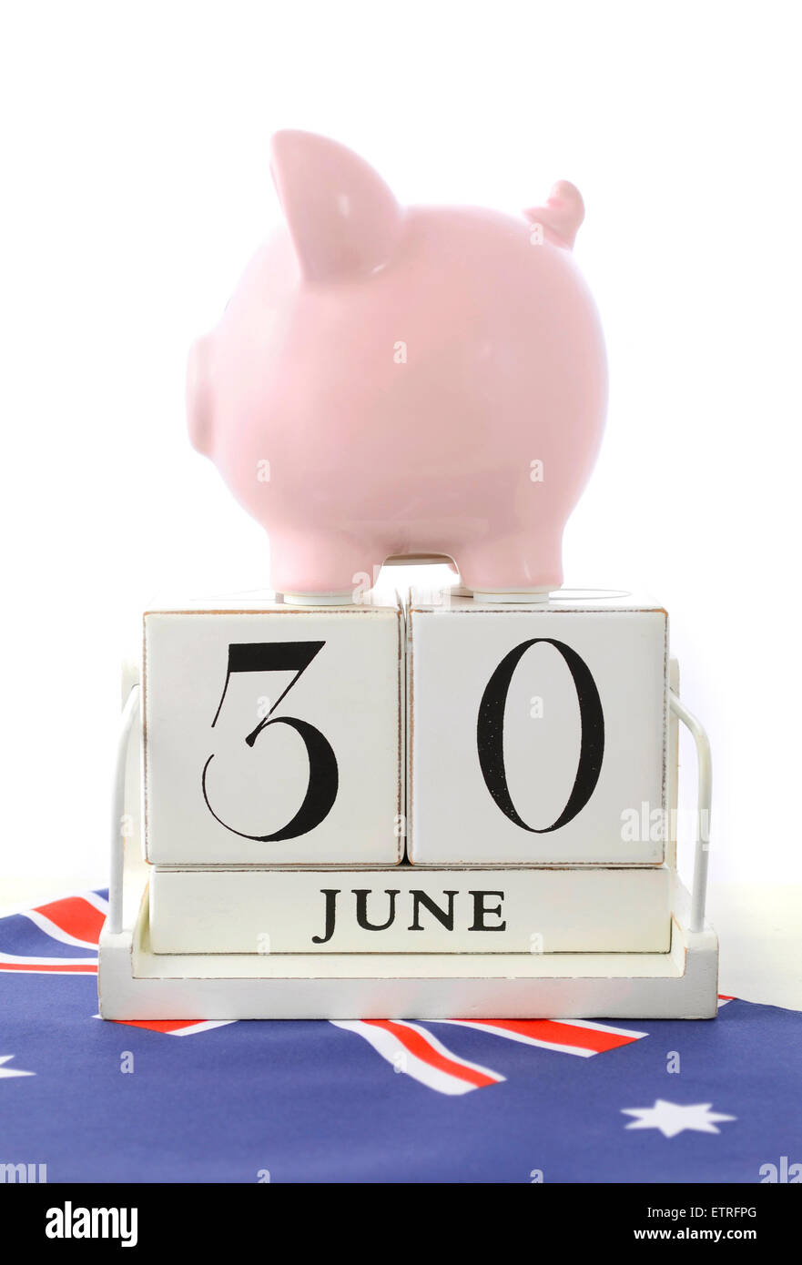 End of Financial Year Savings Concept with piggy bank and wood calendar ...