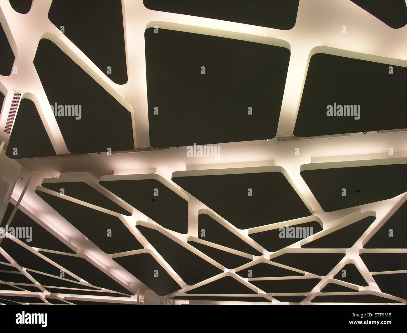 View of a suspended futuristic ceiling with modern lighting Stock Photo ...
