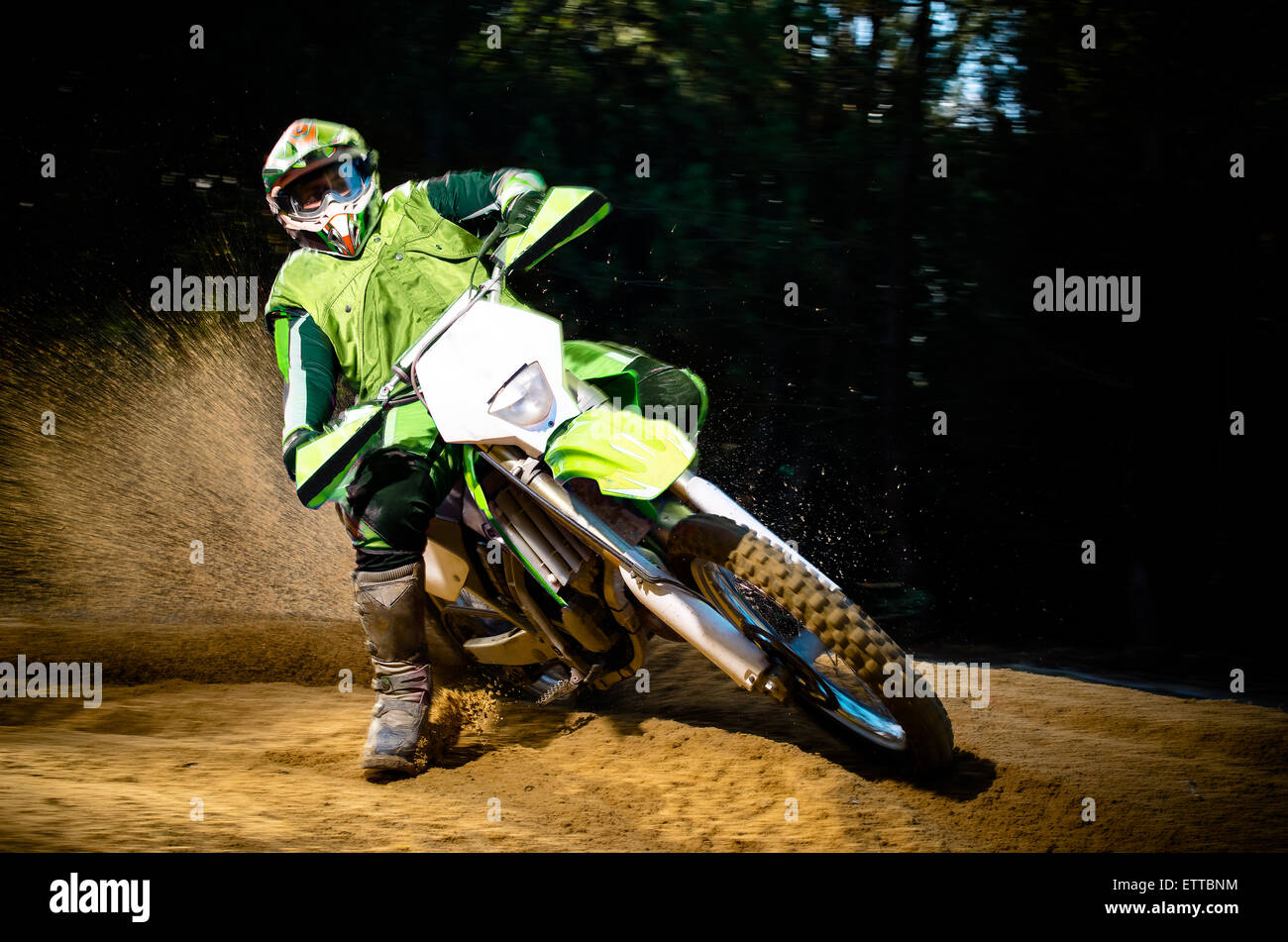 Enduro bike rider on action. Turn on sand terrain Stock Photo - Alamy