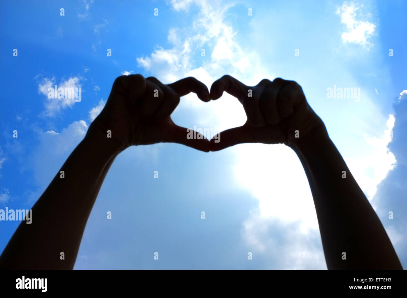 Hands in heart shape over sky Stock Photo - Alamy