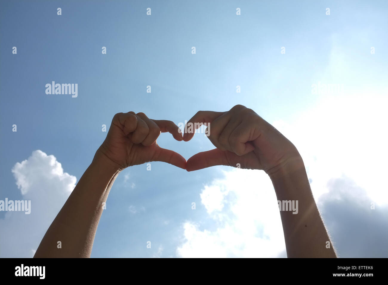 Hands in heart shape over sky Stock Photo - Alamy
