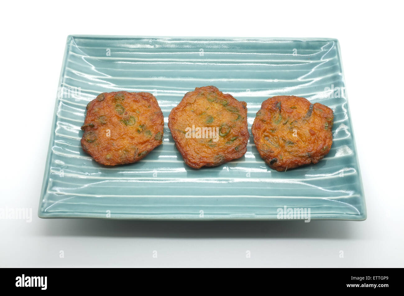 Fried fish patty, spicy fish ball on ceramic dish, Thai food Stock ...