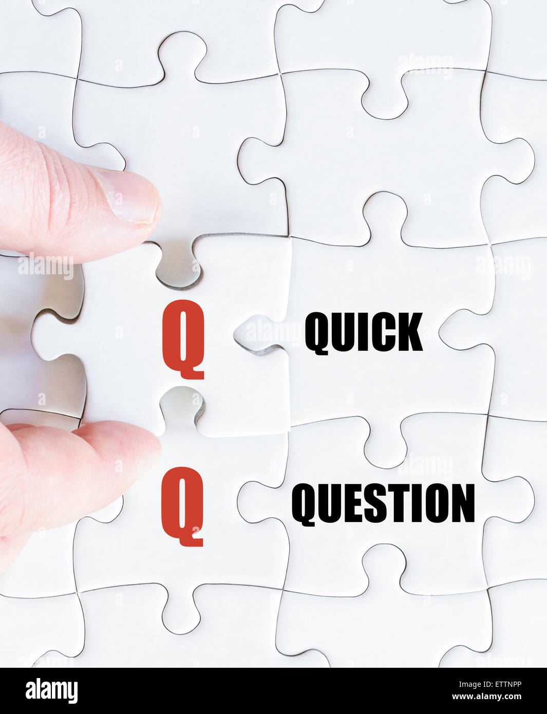 Hand of a business man completing the puzzle with the last missing ...