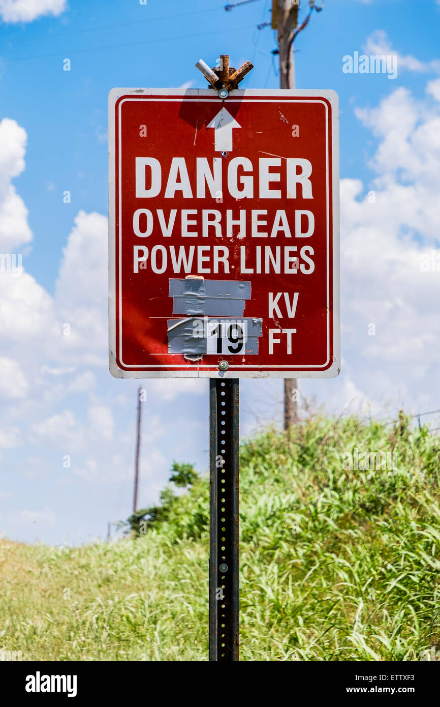 Sign warning of Danger, Overhead Power Lines in rural Oklahoma, USA ...