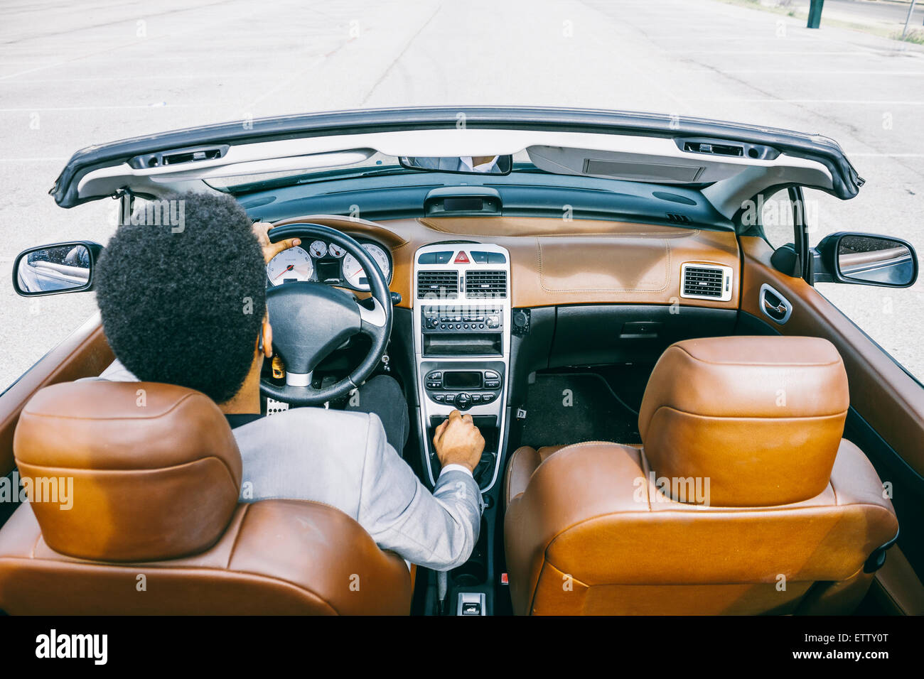 Young black man driving convertible Stock Photo - Alamy