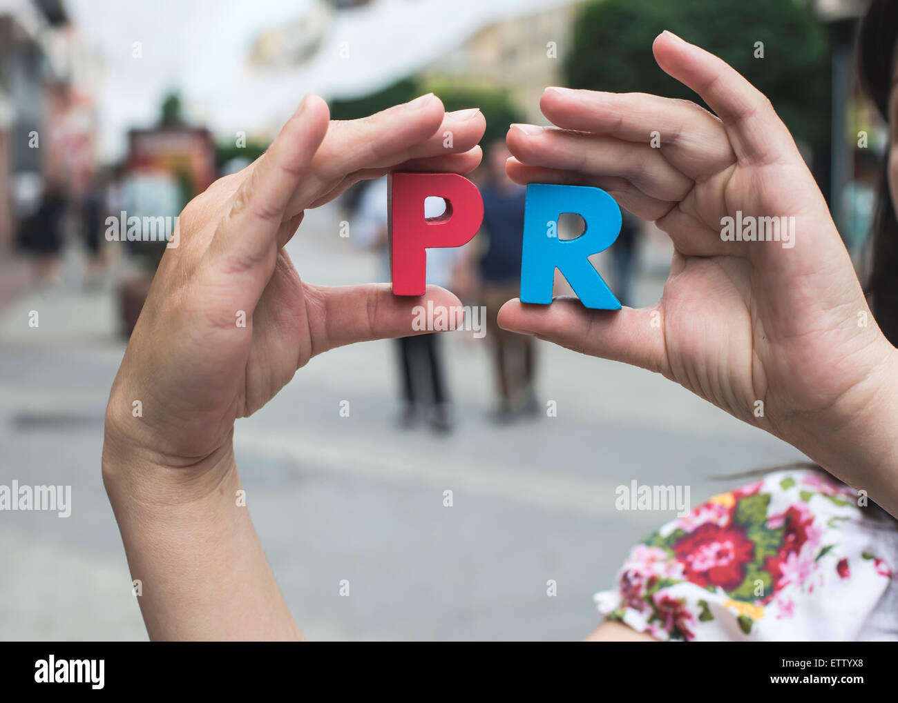 Bulgaria, Hands holding letters PR, pedestrian area Stock Photo - Alamy