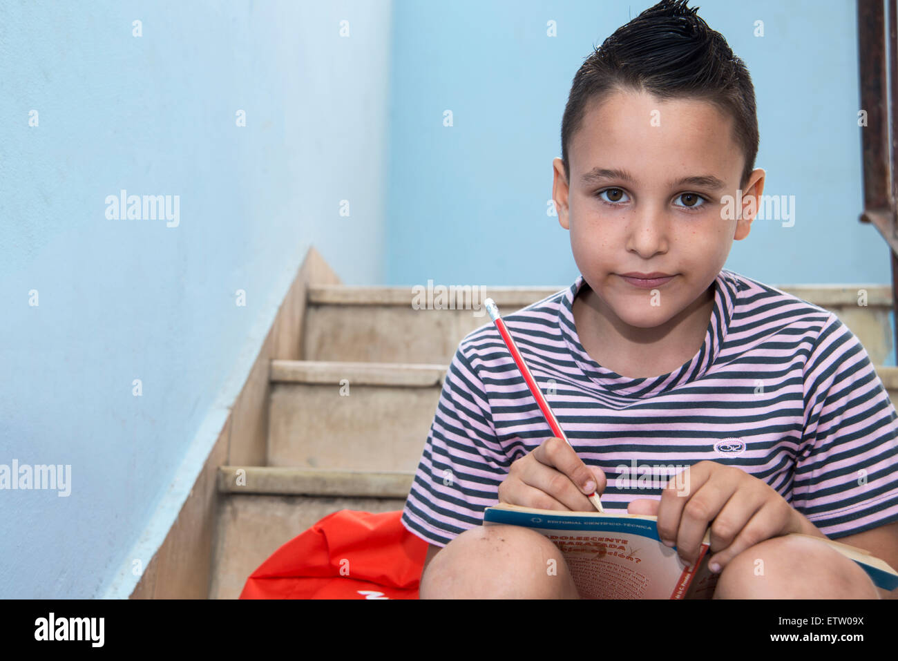 Latin boy with school backpack Stock Photo - Alamy