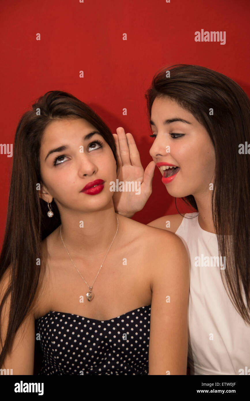 Twin sisters chatting at home Stock Photo - Alamy