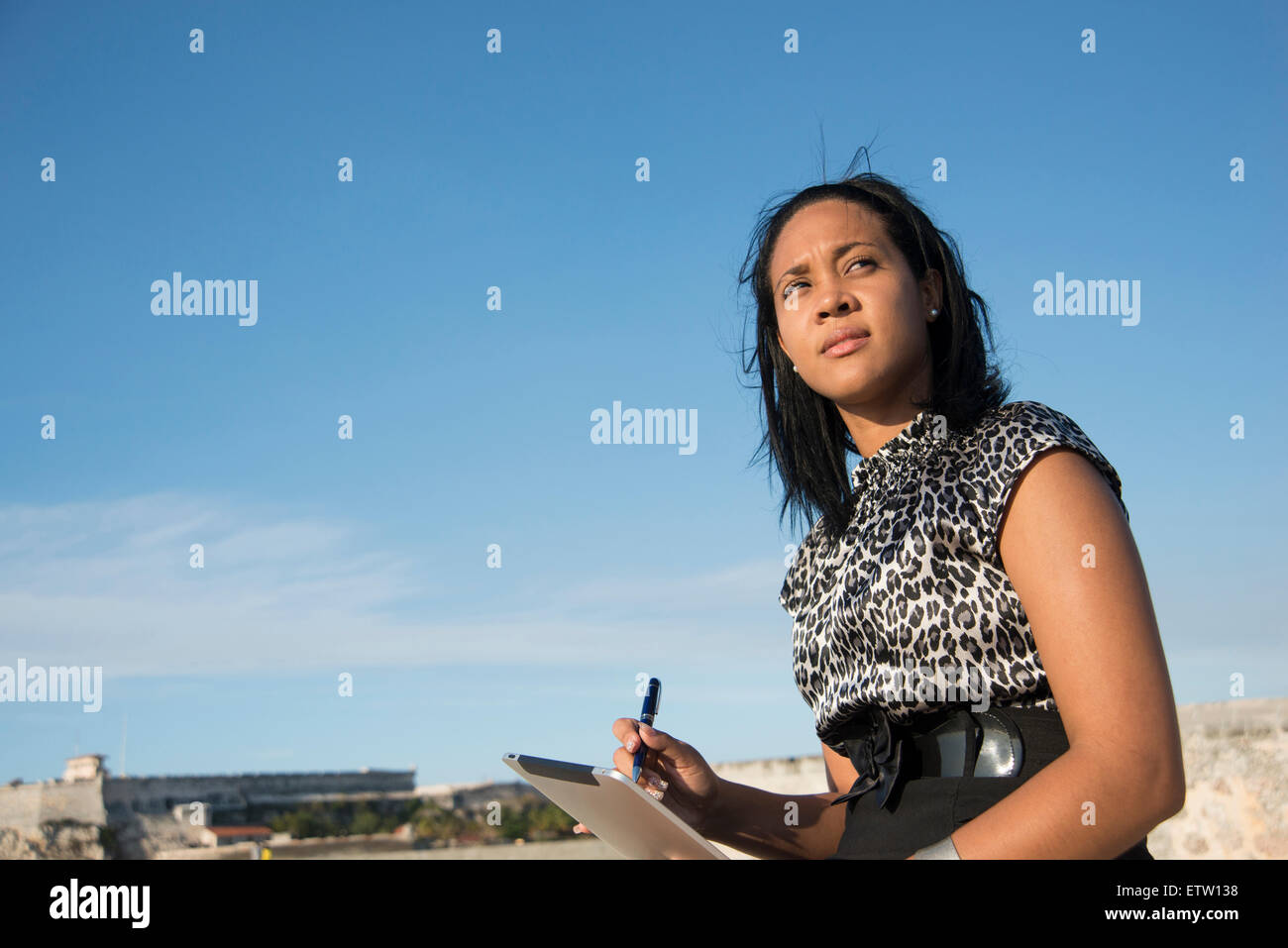 Latin female executive with iPad Stock Photo - Alamy