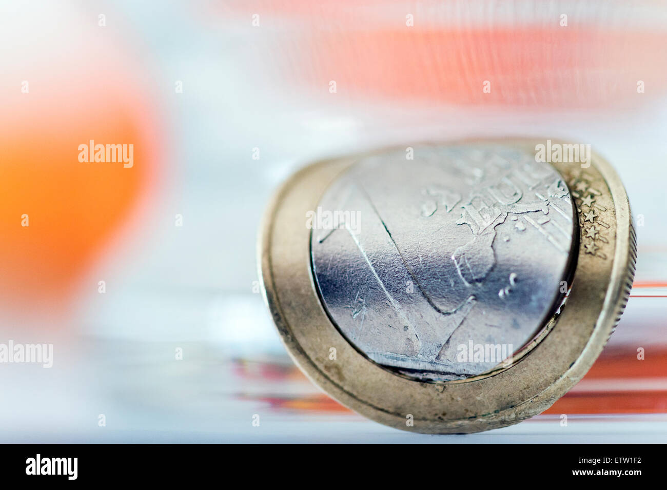 One Euro coin, twisted Stock Photo - Alamy
