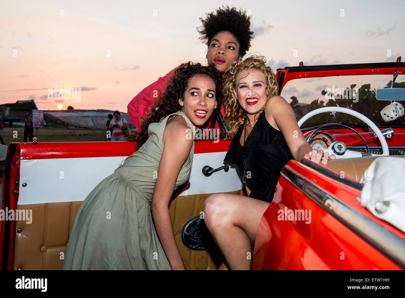 Three young people shopping Stock Photo - Alamy