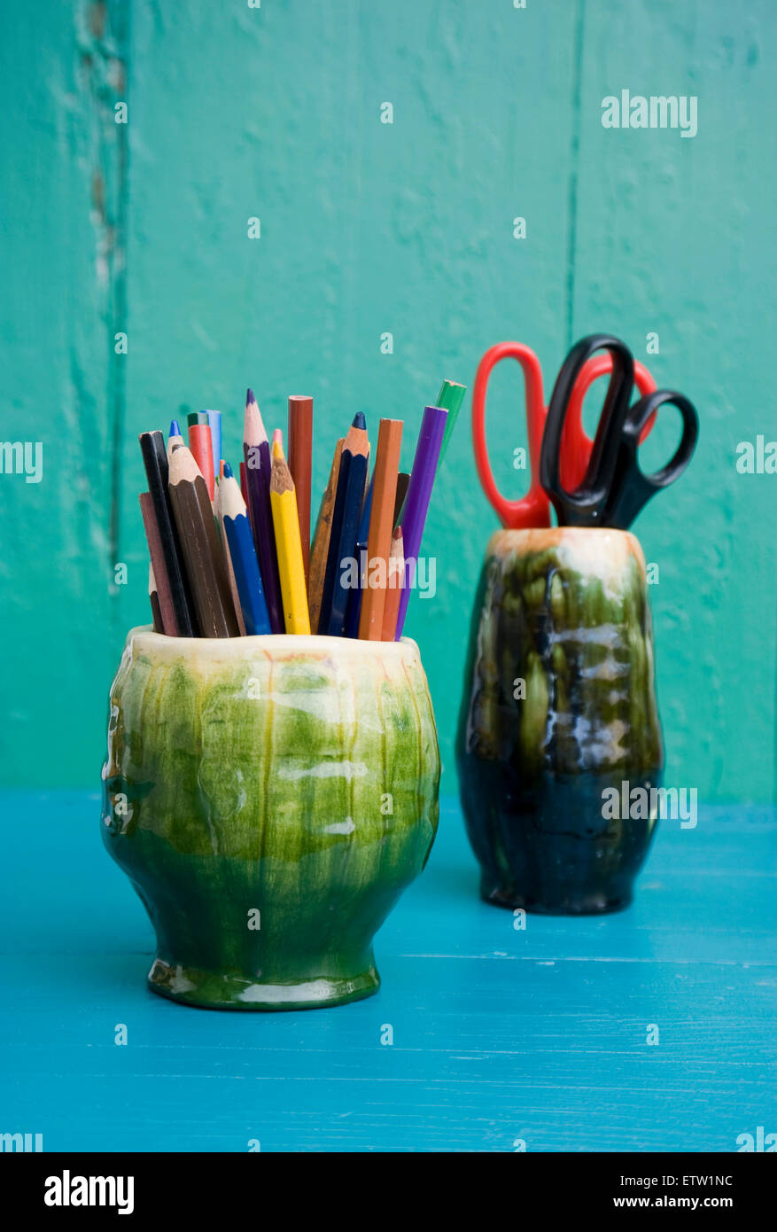Seventies flower vases storing pencils and scissors Stock Photo - Alamy
