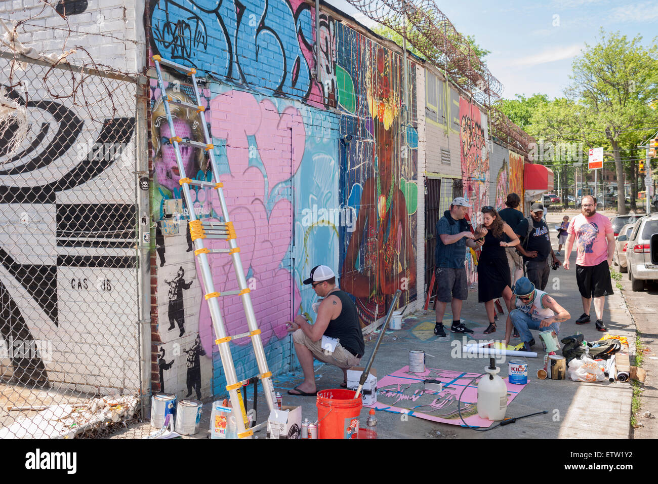 Rubin415 and other street artists at work at the Welling Court Mural Project in the Astoria ...
