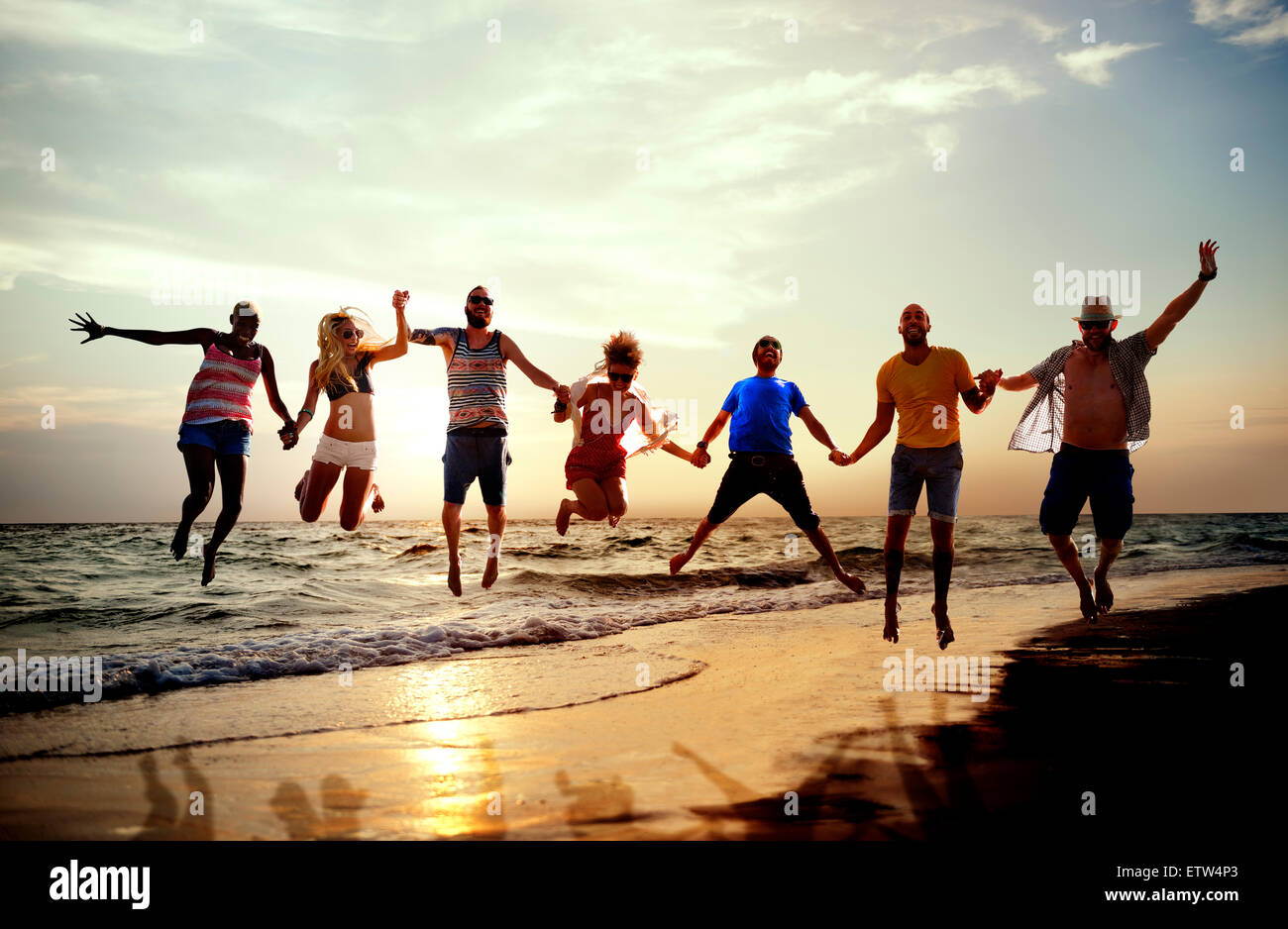 Diverse Beach Summer Friends Fun Jump Shot Concept Stock Photo - Alamy