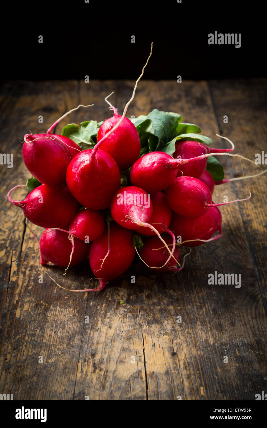Bunch of organic radish on wood Stock Photo - Alamy