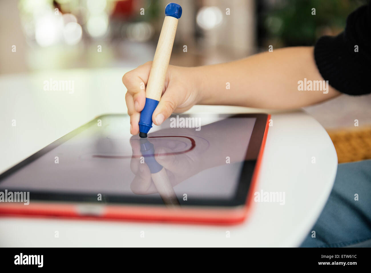Hand of child drawing letter with a digital pen on digital tablet Stock ...