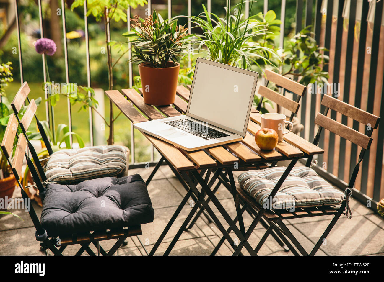 Laptop standing on table of balcony Stock Photo - Alamy