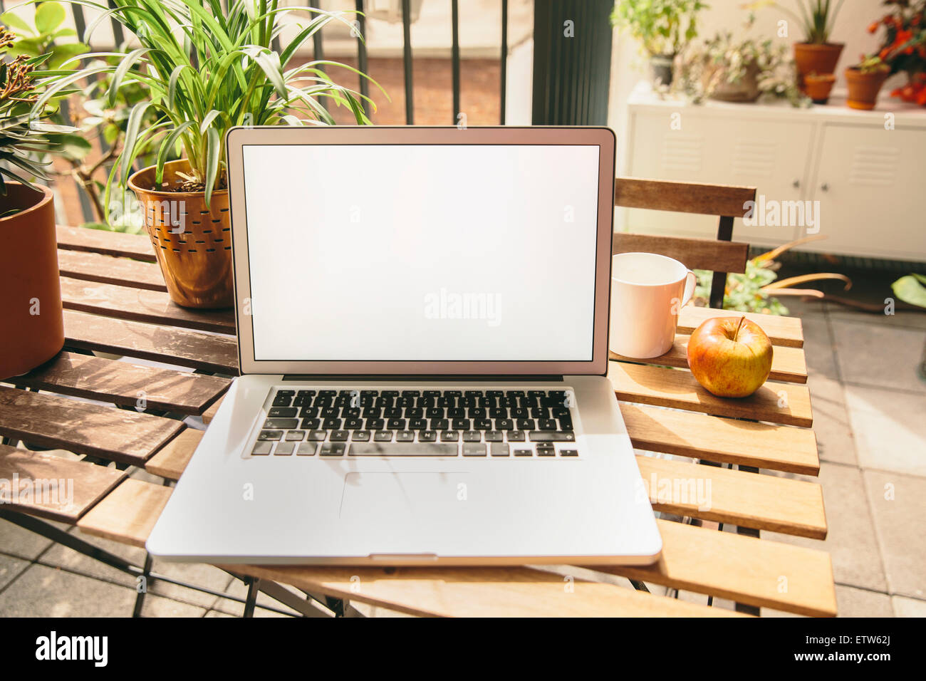 Laptop standing on table of balcony Stock Photo - Alamy