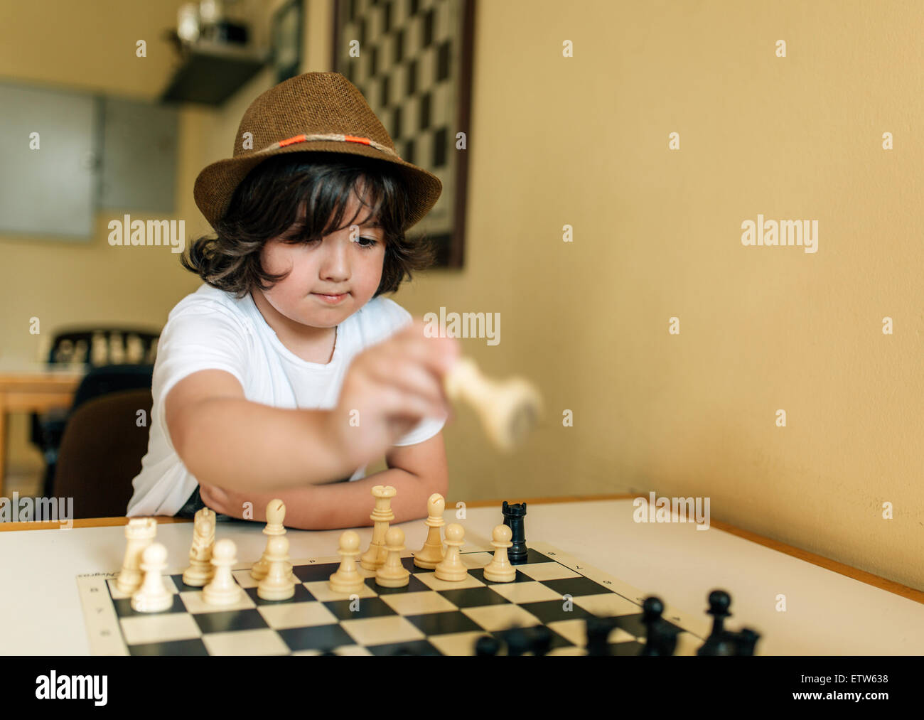 Boy playing chess Stock Photo - Alamy