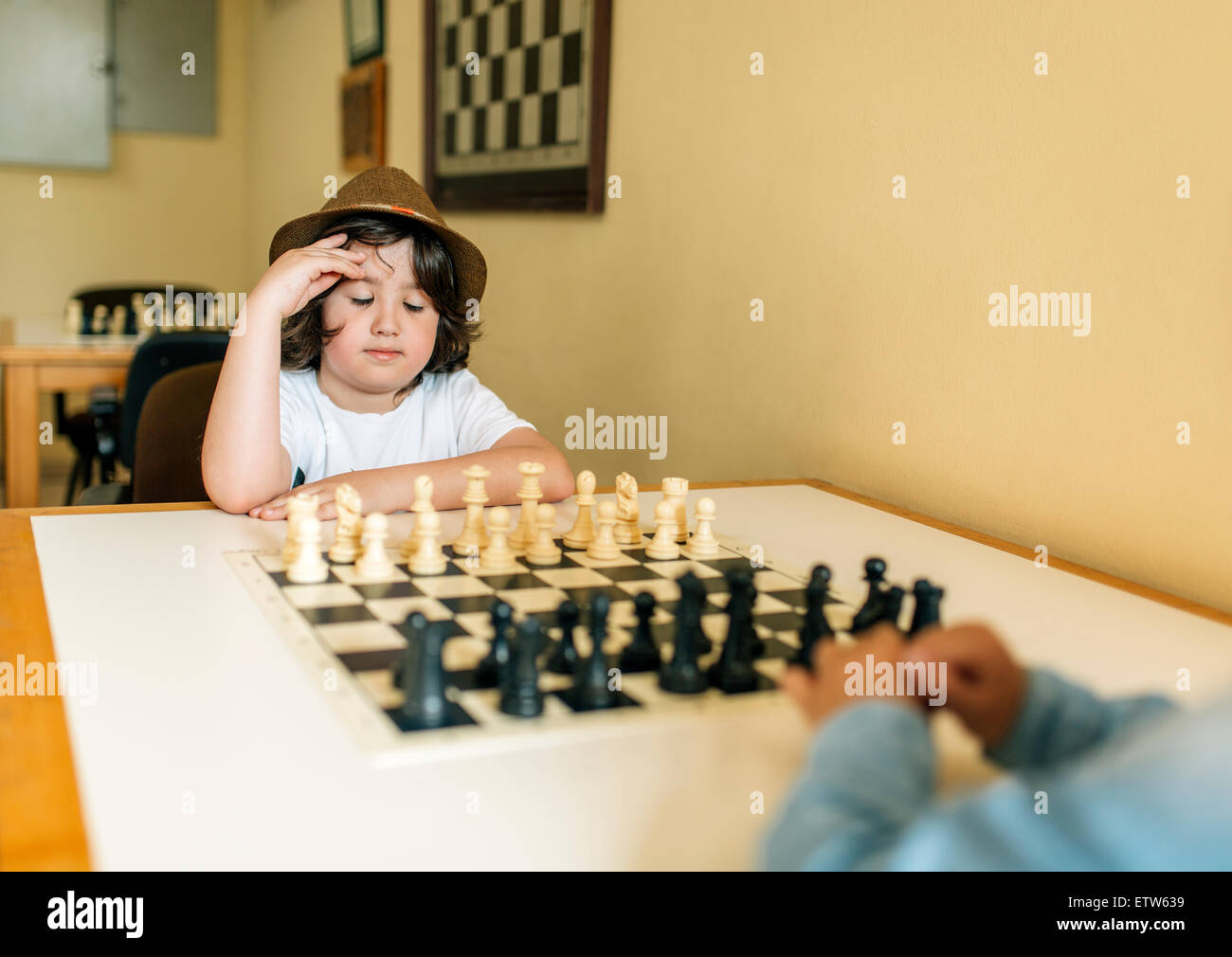 Boy playing chess Stock Photo - Alamy